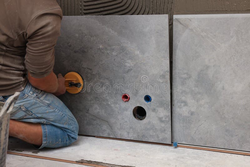 Worker Using Suction Plate for Tile Installation Indoors, Closeup Stock ...