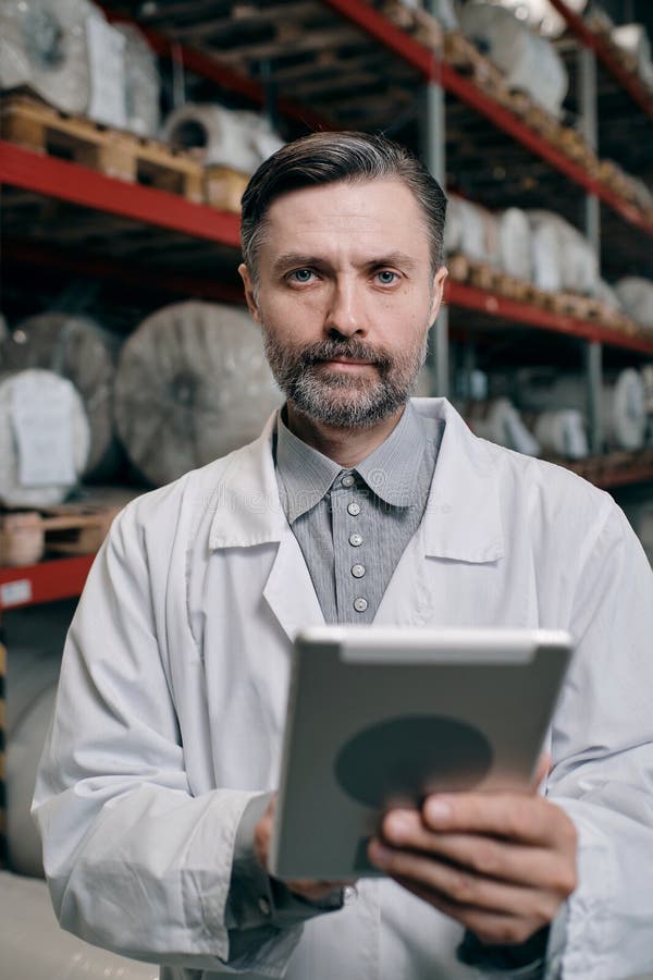 Worker Using Tablet at the Factory Stock Photo - Image of manufacturing ...