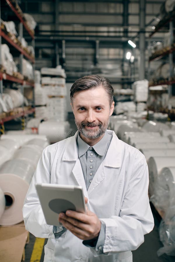Worker Using Tablet at the Factory Stock Photo - Image of material ...