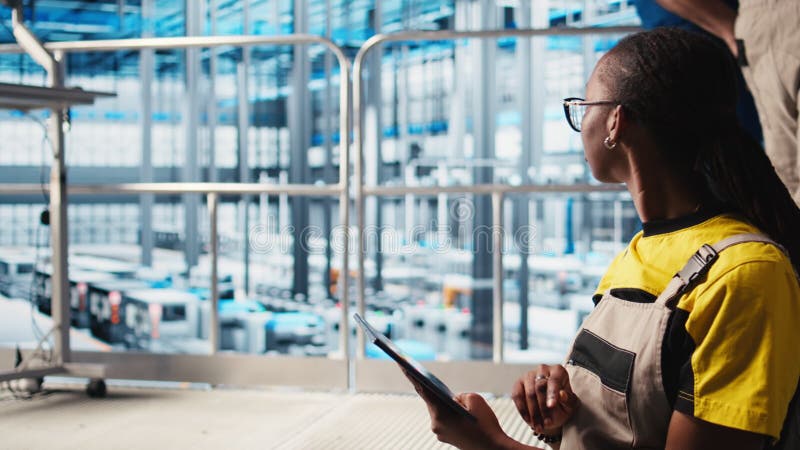 Worker Using Tablet in Smart Factory, Collecting and Analyzing Data ...