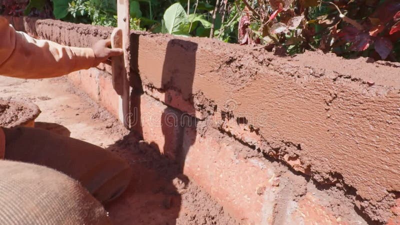 Worker Using a Trowel for Construction Wall Plastering with Fresh ...