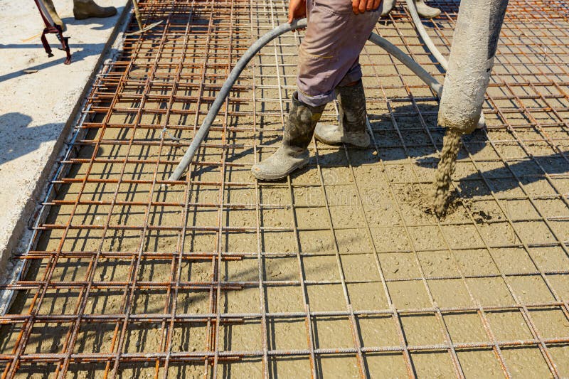 Worker is Using Electric Vibratory To Compact Concrete in Foundation ...
