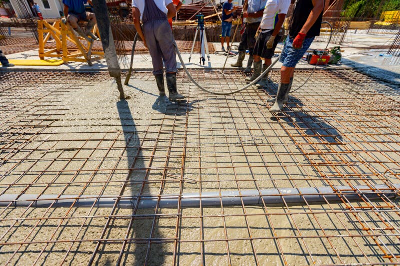 Worker is Using Electric Vibratory To Compact Concrete in Foundation ...