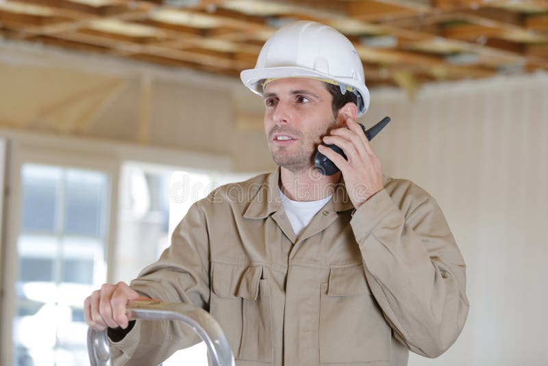 Worker using walkie talkie stock photo. Image of coworkers - 271543674