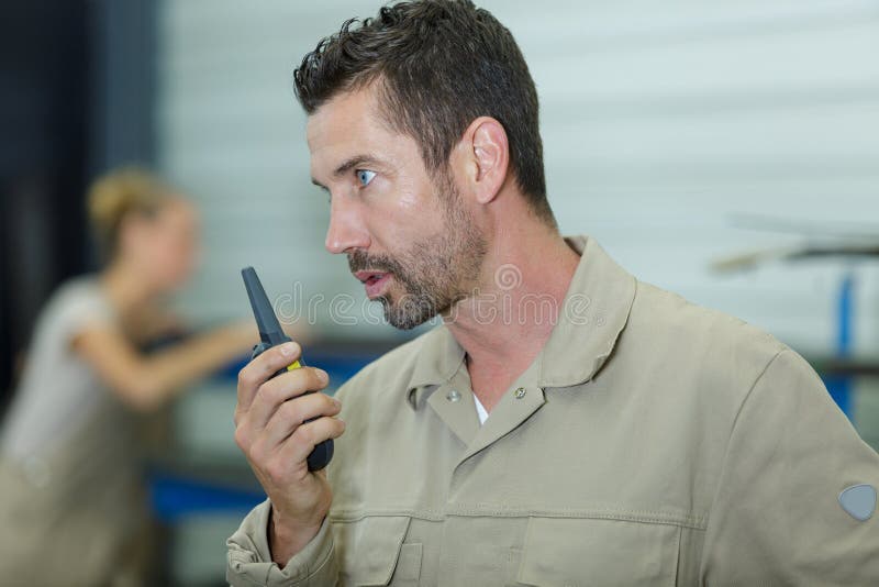 Worker Using Walkie Talkie in Storage Stock Image - Image of technology ...