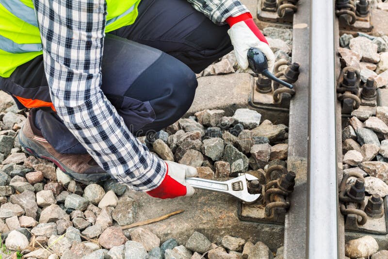 Worker Using Wrench on Railway Stock Photo - Image of railroad, rail ...