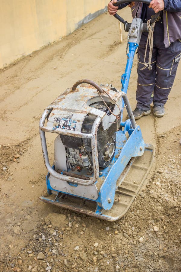Worker with Vibrating Plate Compactor Machine Stock Photo - Image of ...