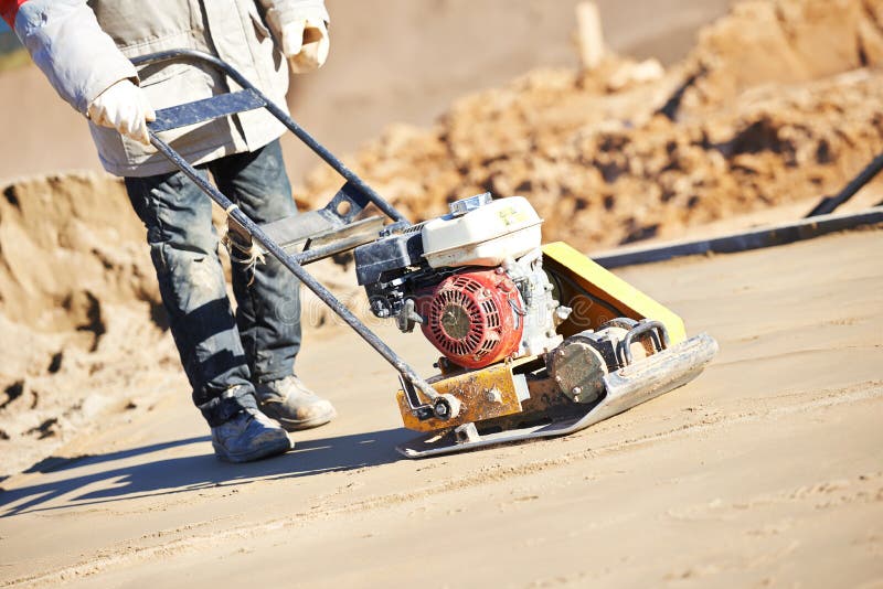 Worker with Compaction Machine Stock Photo - Image of building ...
