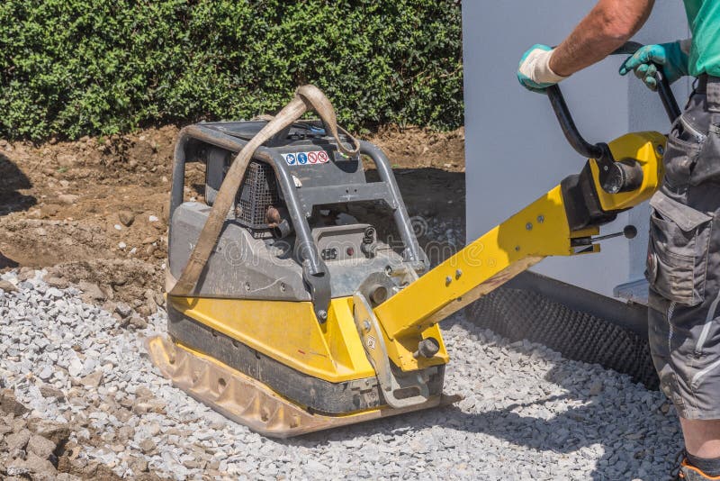 Worker with Vibration Plate - Vibrator Stock Image - Image of tremble ...