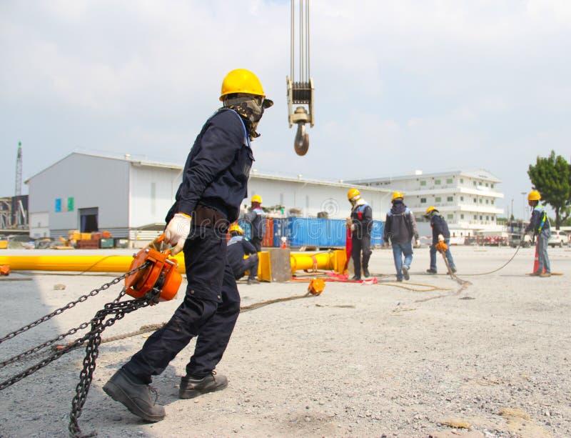 Worker walking pull chains stock image. Image of industry - 35059001