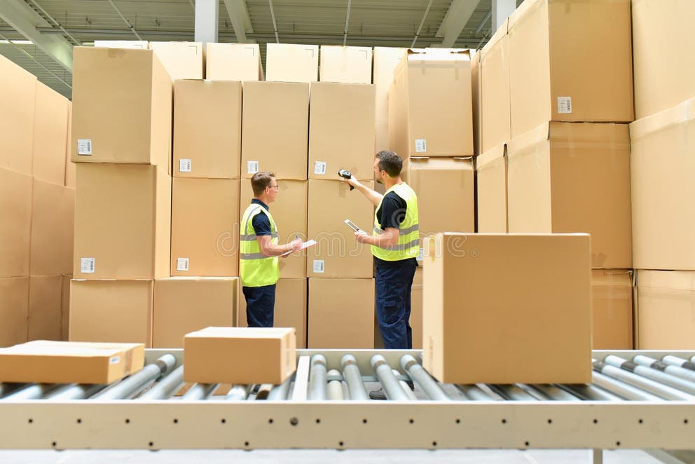 Worker in a Warehouse in the Logistics Sector Processing Packages on ...