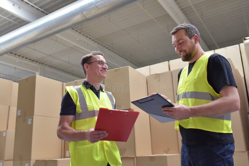 Worker in a Warehouse in the Logistics Sector Processing Packages on ...