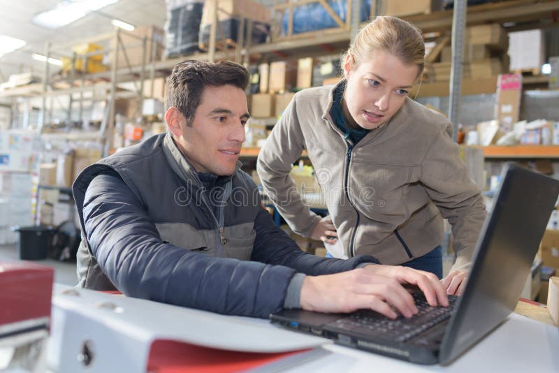 Worker in Warehouse Looking at Internet Stock Image - Image of ...
