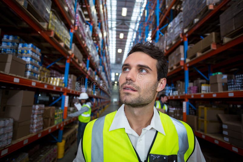 Worker in Warehouse Looking Up Stock Image - Image of looking ...
