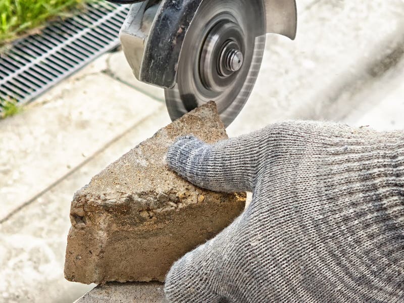 Cutting Concrete Block with a Power Tool in Outdoor Construction ...