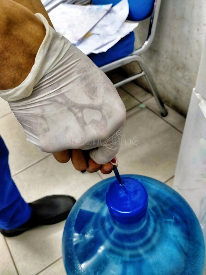 The Worker is Wearing the Hand Gloves and Knife when Opening the Lid ...