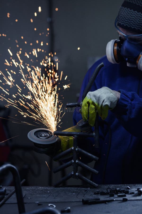 Worker Wearing Protection Equipment Using an Angle Grinder on Metal and ...