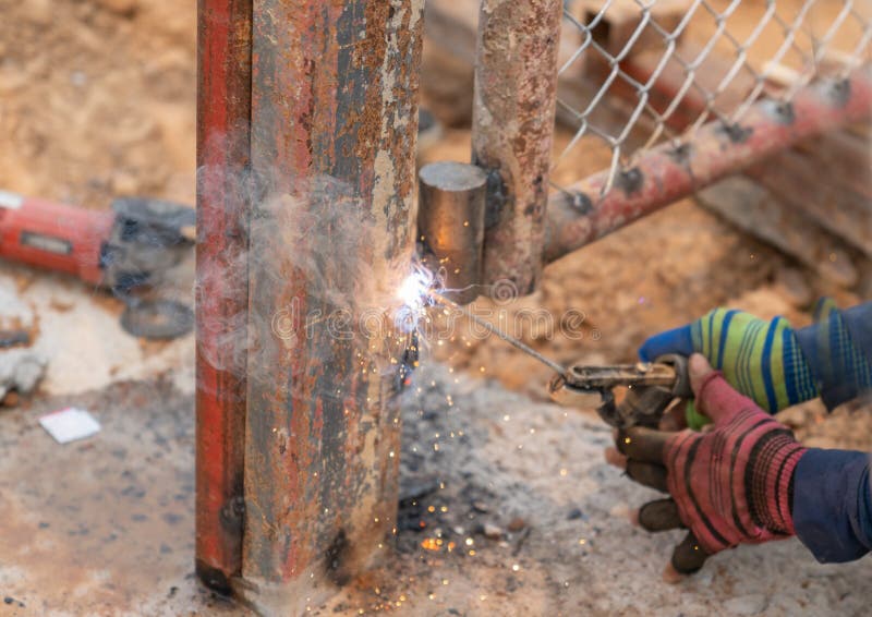 Worker Welding Door Hinge with Pole Stock Image - Image of ...