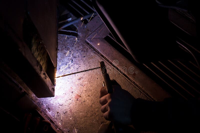 Worker welding garage door stock photo. Image of occupation - 109703490