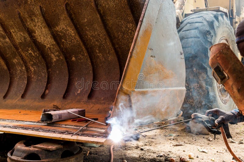 Worker welding the iron stock image. Image of craftsman - 98297043