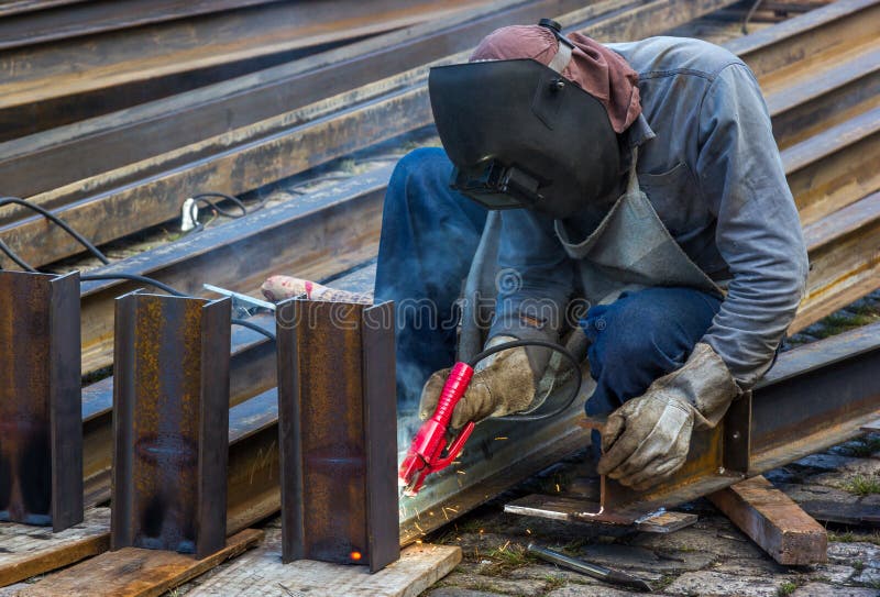 Worker Welding the Iron Pieces Stock Image - Image of equipment ...