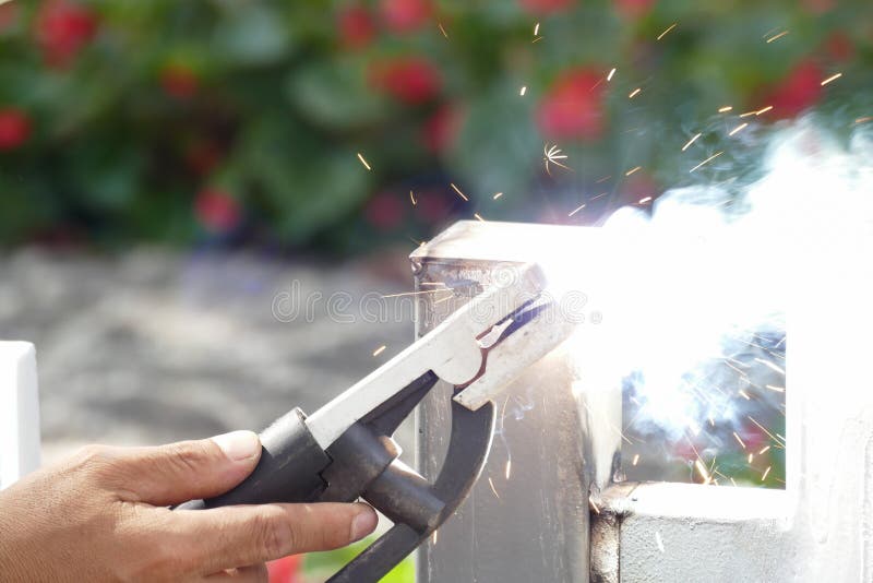 The Worker Welding the Iron Pole Stock Image - Image of industry, flame ...