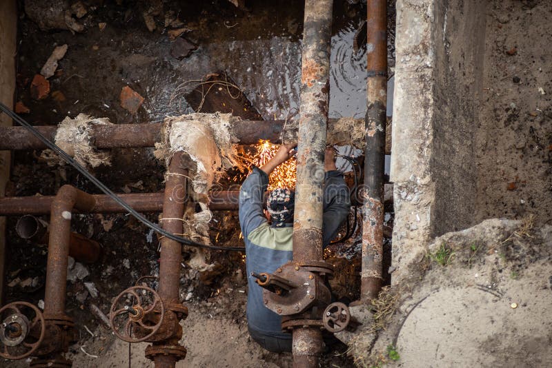 Worker with a Welding Machine Editorial Photo - Image of pipe, spark ...