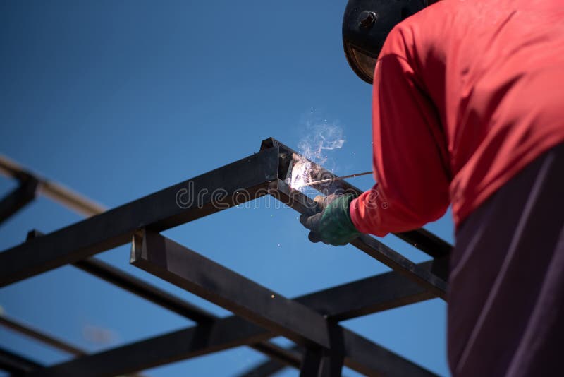 Worker Welding the Roof Steel in Construction Site. Stock Image - Image ...
