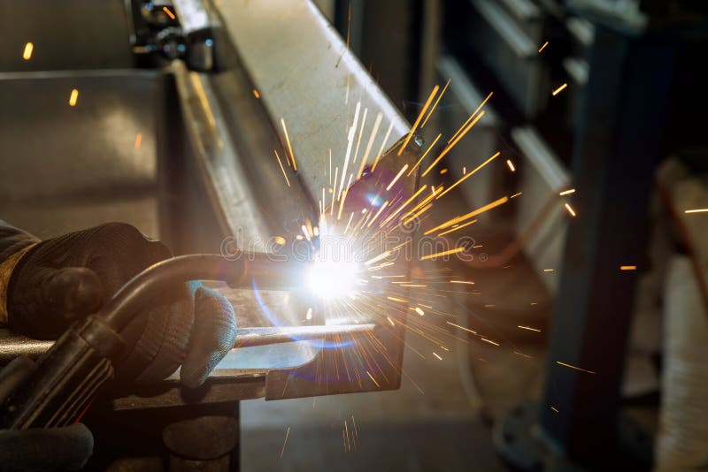The Worker is Welding with a Semi-automatic Argon Gas Shielded Welding ...