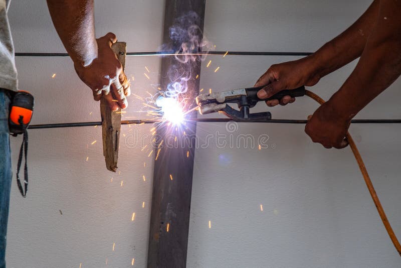Worker welding steel bar. stock image. Image of factory - 137198167