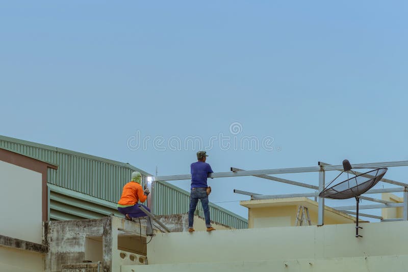 Worker Welding the Steel Part for Roof Editorial Stock Image - Image of ...