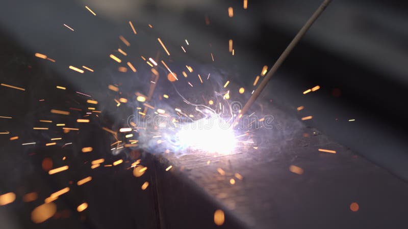Worker Welding Two Pieces of Rectangular Tubing Together for Structure ...