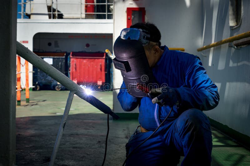 Worker during welding stock image. Image of factory - 126313897