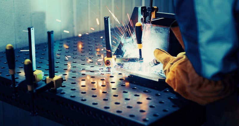 Man Welds at the Factory Working in Metal Industry Stock Image - Image ...