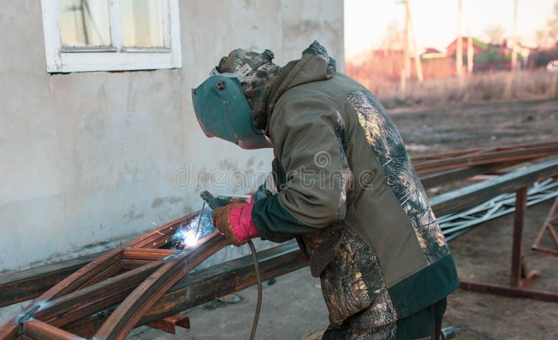 A Worker Welds Metal for a Canopy Stock Image - Image of canopy ...