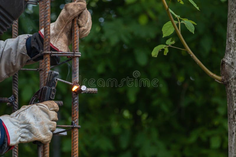 A Worker Welds a Reinforcement - Future Column - Construction Concept ...