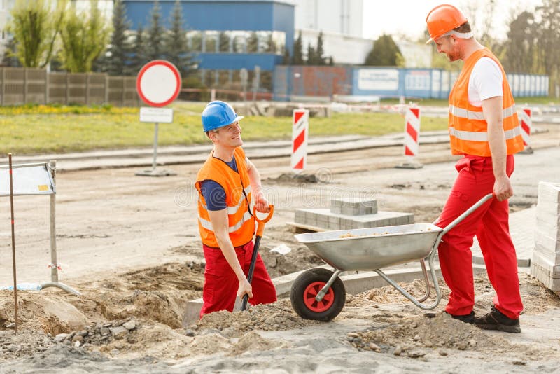 Worker with wheelbarrow stock photo. Image of industry - 70681554