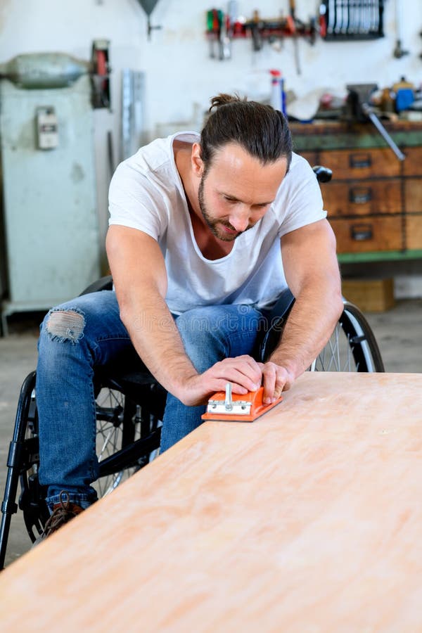 Worker in Wheelchair in a Carpenter`s Workshop Stock Photo - Image of ...