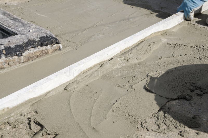 Worker Who Throws Cement on a Building Site Stock Photo - Image of ...