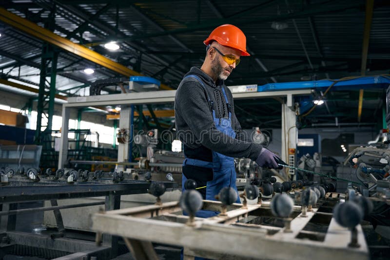 Worker in a Window Production Processes the Edge of Glass Stock Image ...