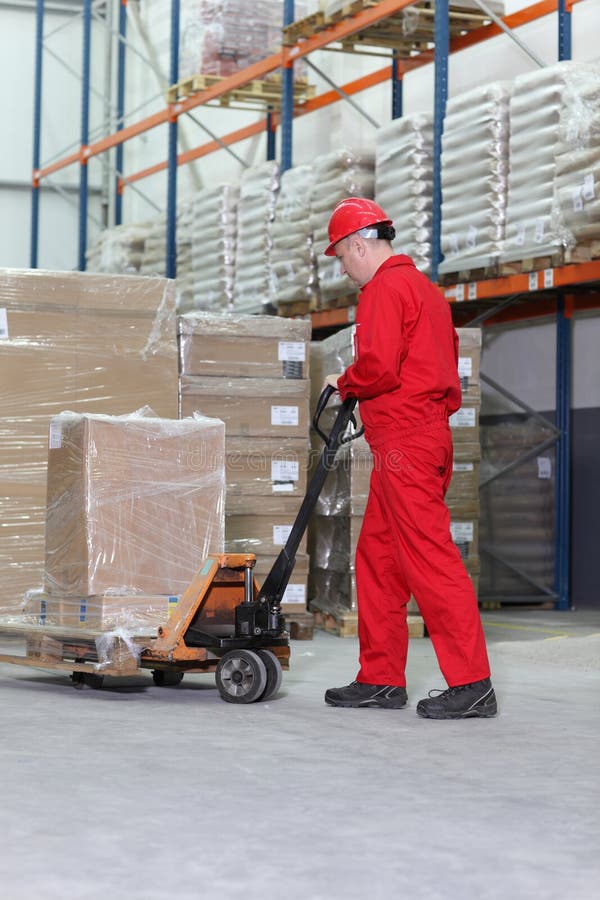 Worker at Work with Hand Powered Pallet Jack Stock Image - Image of ...