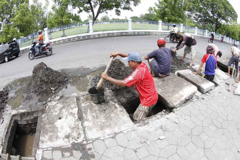Men cleaning the drains editorial stock photo. Image of cleaning ...