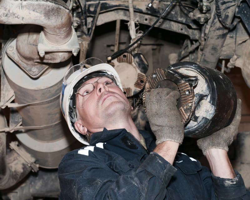 Worker Working on a Broken Down Truck Stock Image - Image of black ...