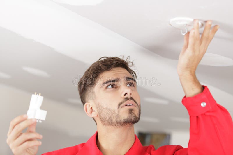 Worker working on ceiling stock photo. Image of tool - 258028178