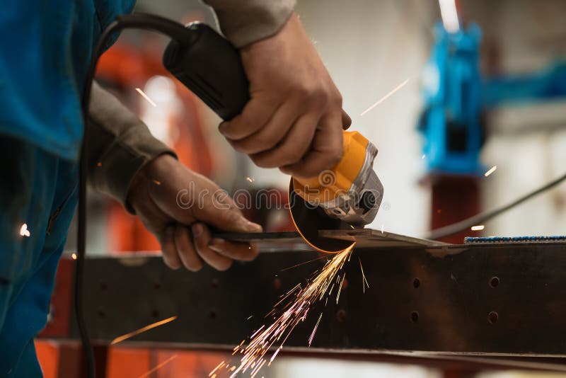 Worker Working with a Circular Grinder on a Metal with Sparks Stock ...