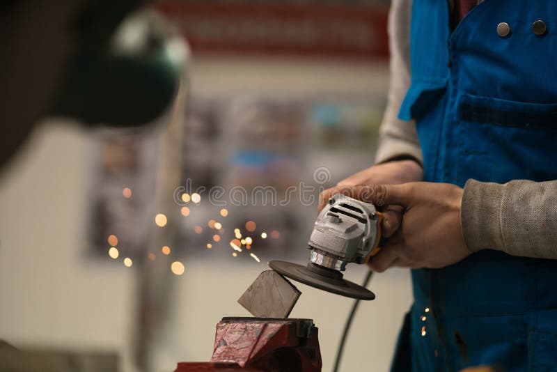 Worker Working with a Circular Grinder on a Metal with Sparks Stock ...