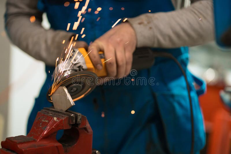 Worker Working with a Circular Grinder on a Metal with Sparks Stock ...