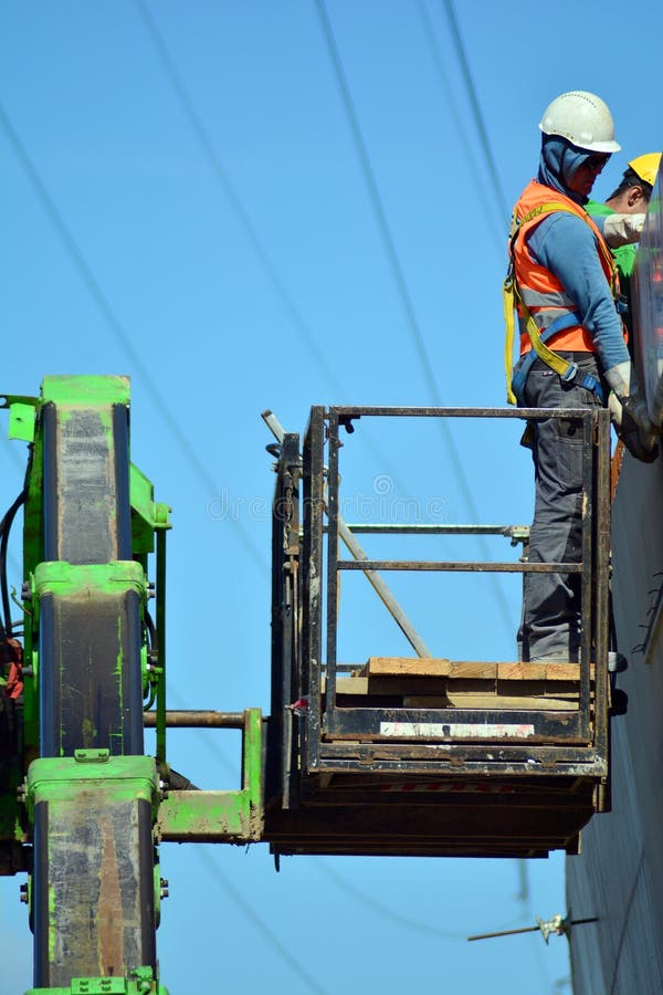 Construction Workers on a Scaffold. Stock Image - Image of large ...