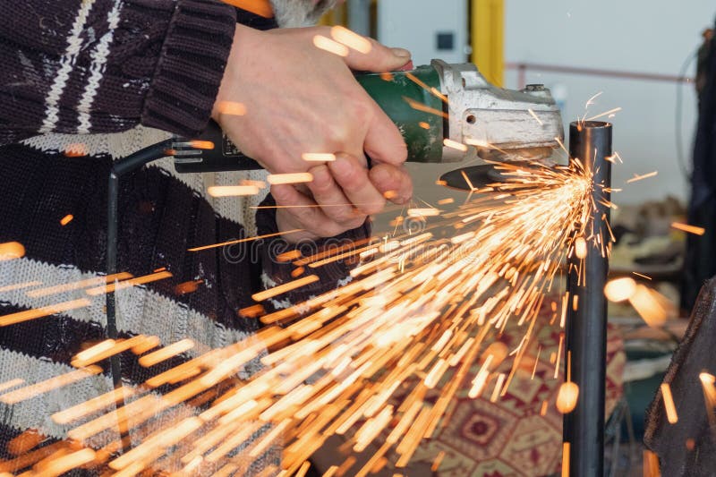 Worker Working with Hand Grinder Stock Photo - Image of engineering ...