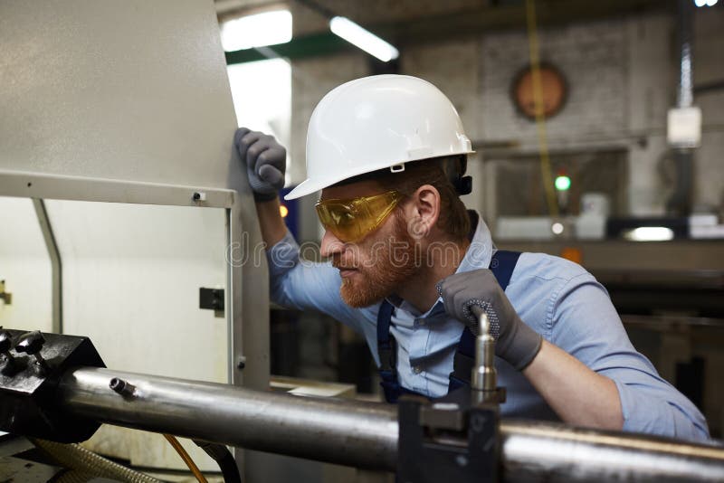Worker working on lathe stock photo. Image of concentration - 161873752